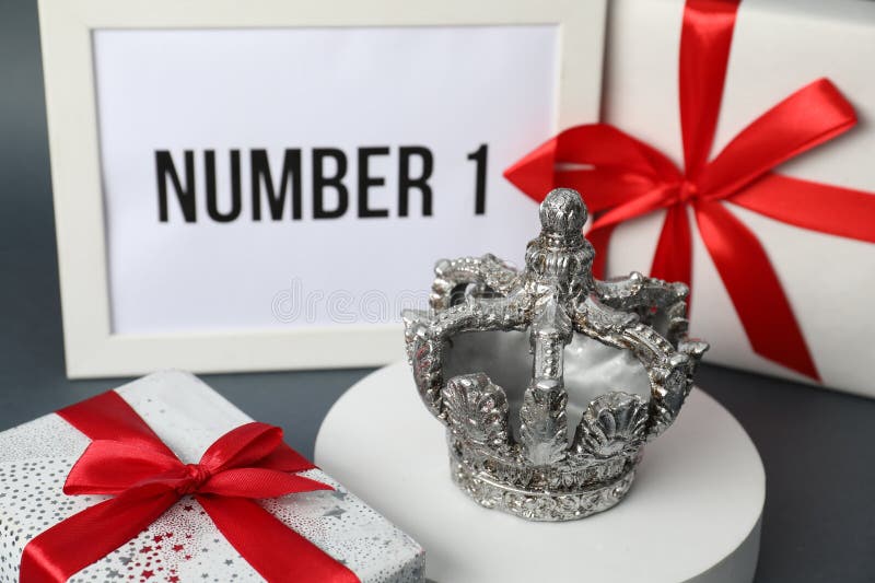 Crown, Frame with Phrase Number 1 and Gift Boxes on Grey Table, Closeup ...
