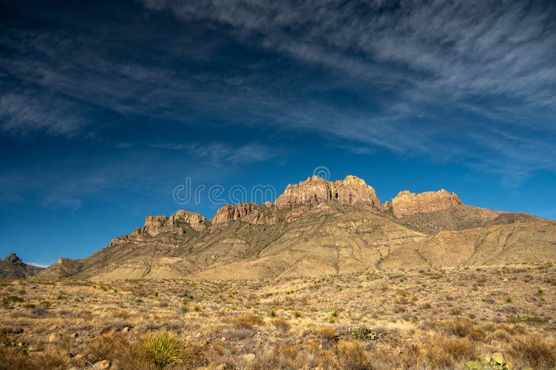 Crown Mountain Under Deep Blue Sky and Wispy Clouds Stock Photo - Image ...