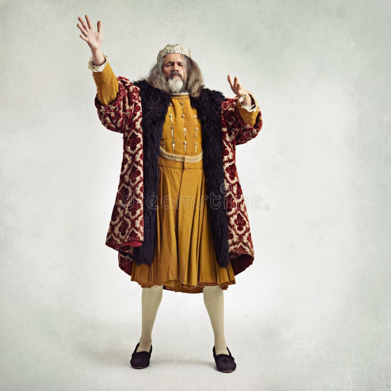 The Crown Weighs Heavy. Studio Shot of a Richly Garbed King. Stock ...