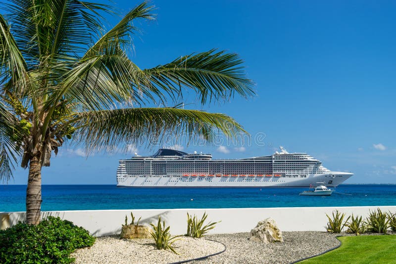 Cruise Ship in Crystal Blue Water with a Palm on the Front Stock Photo ...