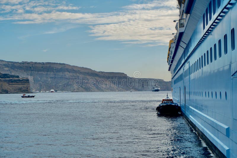 A Tender Alongside a Cruise Ship in Santorini, Greece Stock Image ...