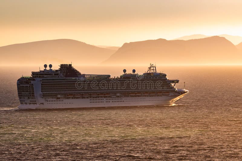 Cruise ship at sunset stock photo. Image of island, pamper - 260968534