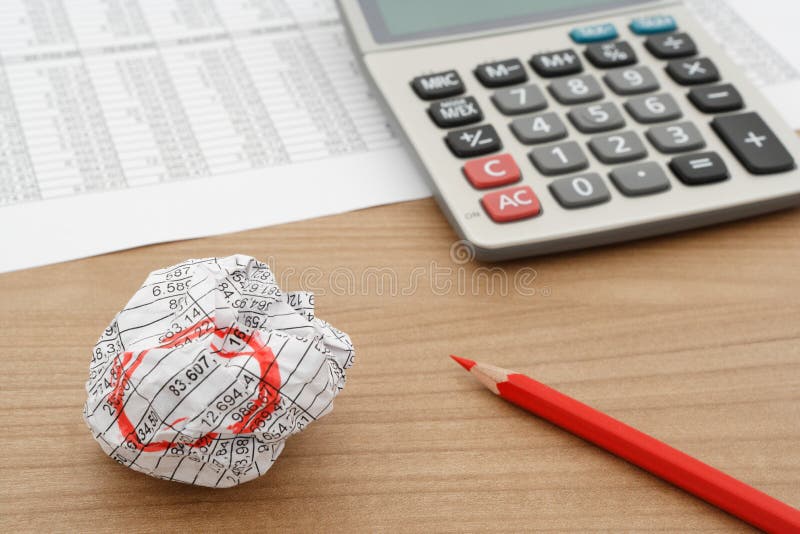 Crumbled Document on Wooden Table with Calculator and Red Pencil Stock ...