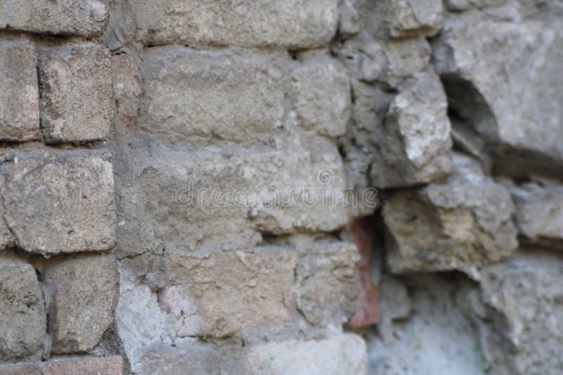 Crumbling Brick Wall Revealing Layers of Weathered Masonry and Plaster ...