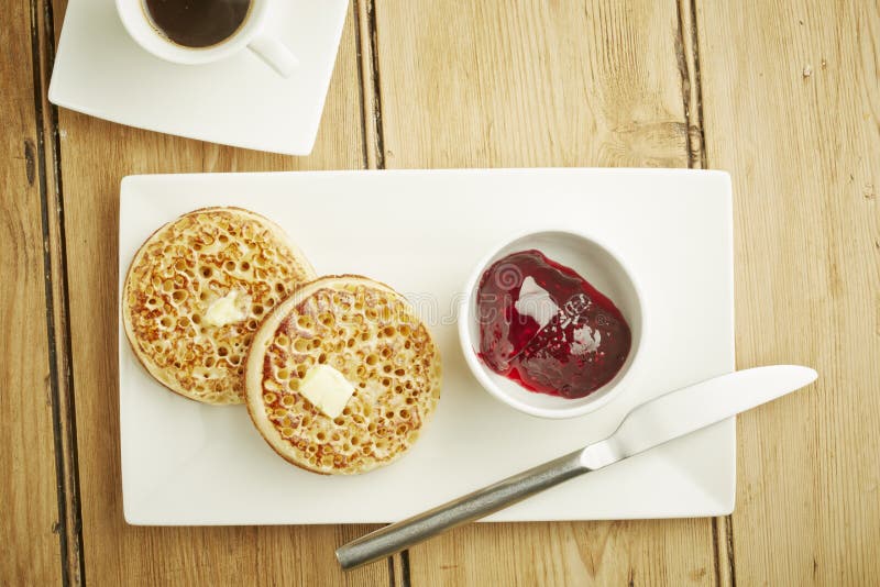 Crumpets Toasted on White Dish Stock Photo - Image of crumpet, cakes ...