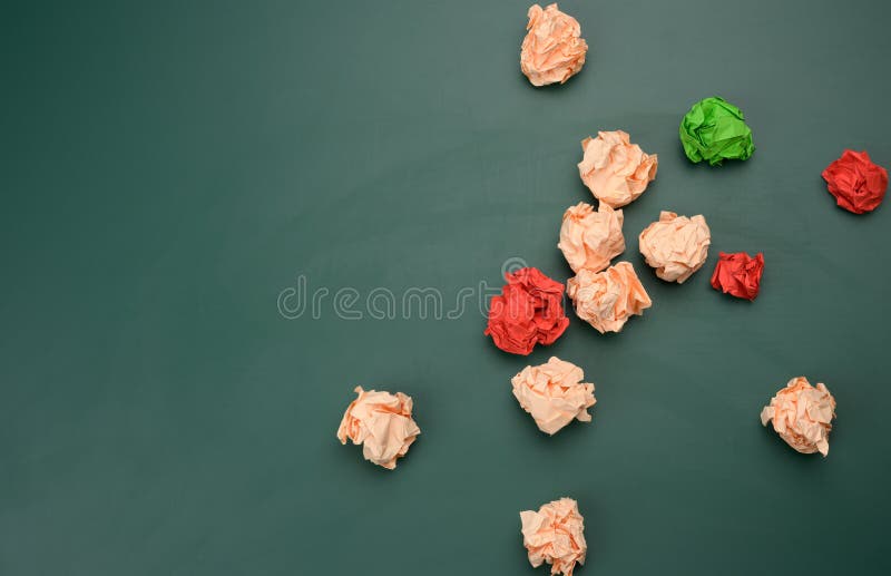 Crumpled Balls of Paper on a Green Background, Top View. Concept of ...