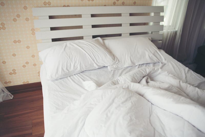 Crumpled bed in bedroom stock image. Image of mattress - 160648977