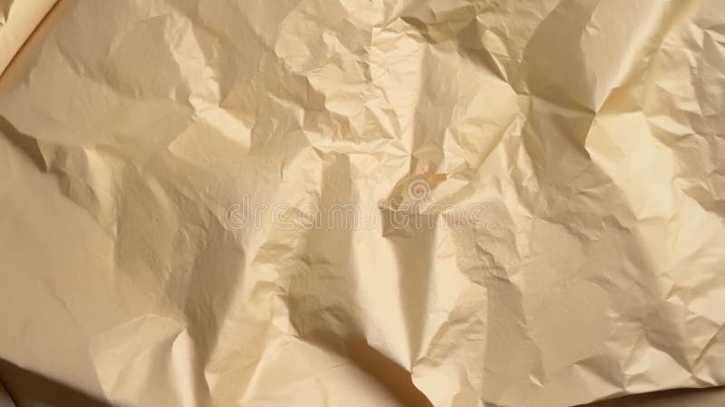 Crumpled Brown Paper Lies Flat on a Surface, Showcasing Its Textured ...