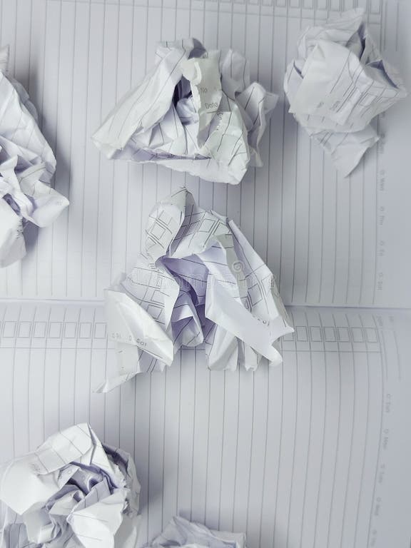 Crumpled Graph Papers Scattered Over an Open Notebook Represent ...