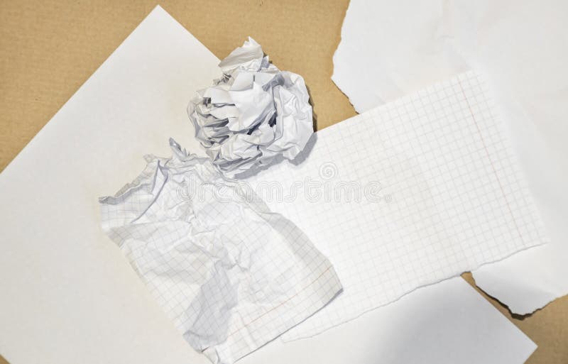 Crumpled Paper Ball on Desktop with Blank Sheets of Drawing Paper ...