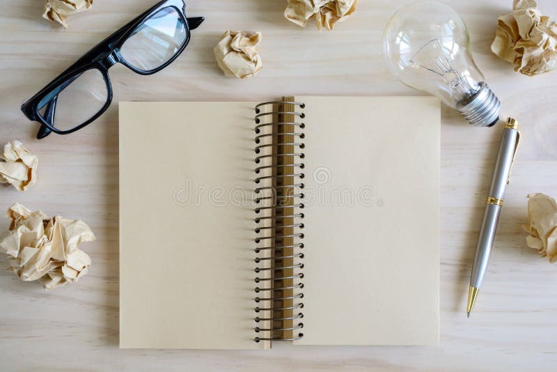 Crumpled Paper Balls with Eye Glasses and Blank Notebook Stock Image ...