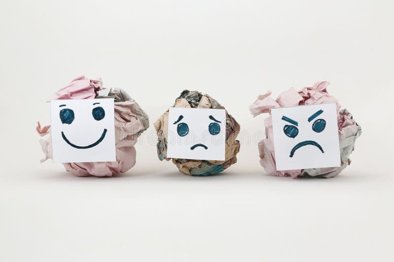 Crumpled Paper Balls with Smiling, Sad and Angry Faces on a White ...