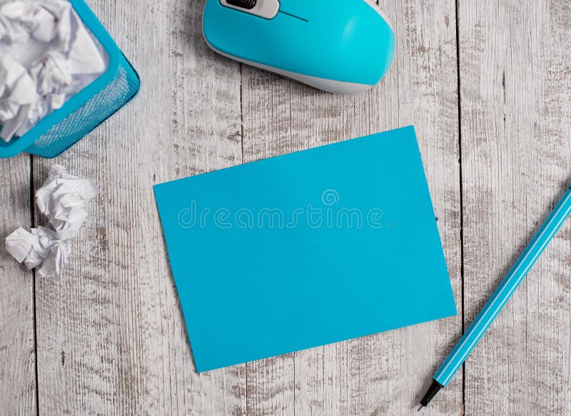 Crumpled Paper and Computer Mouse with Stationary Placed Above Wooden ...