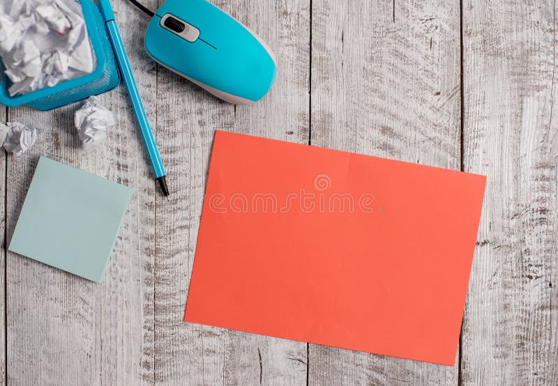 Crumpled Paper and Computer Mouse with Stationary Placed Above Wooden ...