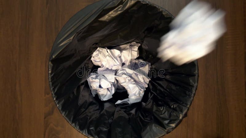 Crumpled Paper into Trash stock footage. Video of garbage - 219524490