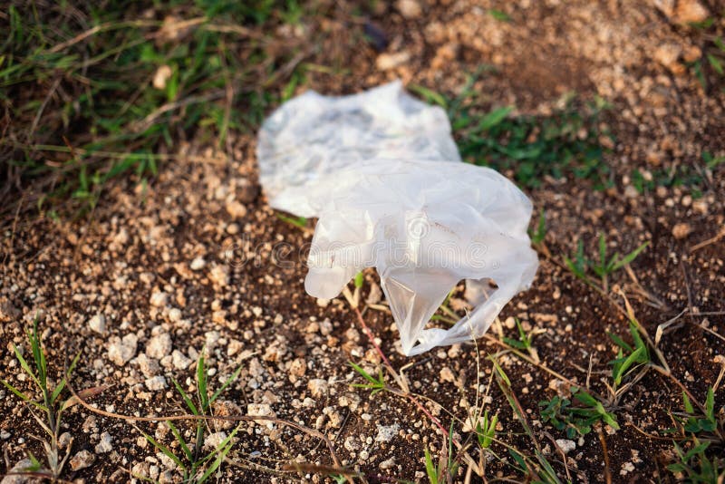 Crumpled Plastic Bag on the Ground. Plastic Waste Polluting Nature ...
