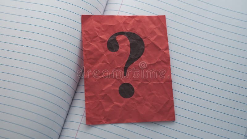 A Crumpled Red Paper Note with a Question Mark on it Lying in an Open ...