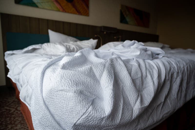 Crumpled Sheets of a Hotel Bed in the Morning Stock Photo - Image of ...