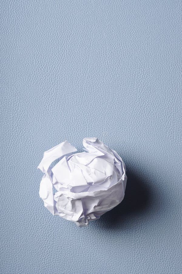 Crumpled-up Ball of Paper on Blue Background Stock Photo - Image of ...