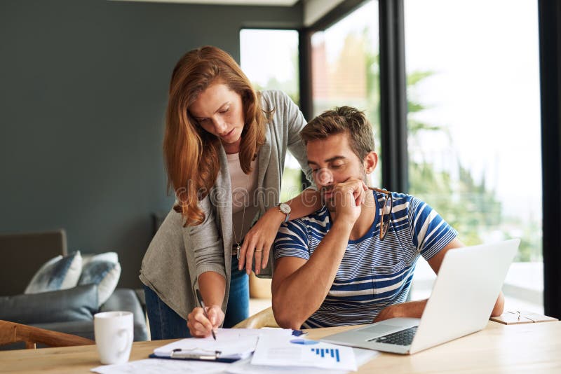 Crunching Some Numbers. a Young Couple Working on Their Household ... Crunching Some Numbers. a Young Couple Working on Their Household ...