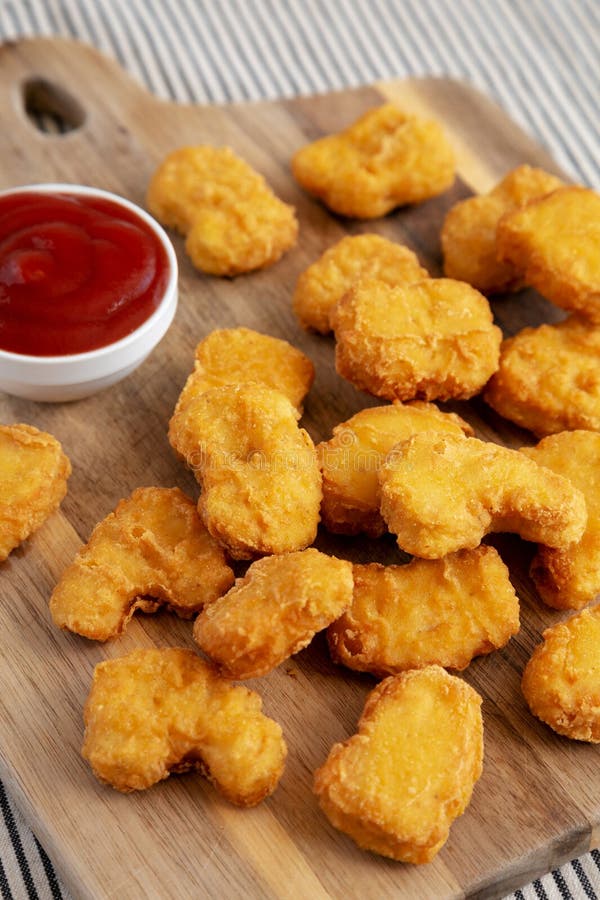 Crunchy Chicken Nuggets with Ketchup on a Wooden Board, Side View Stock ...