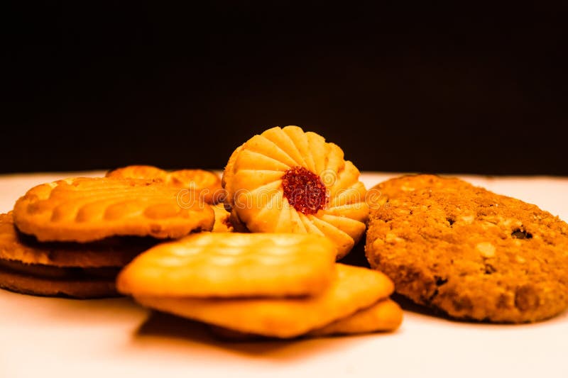 Crunchy Cookies of Different Types and Flavors on Black Background ...