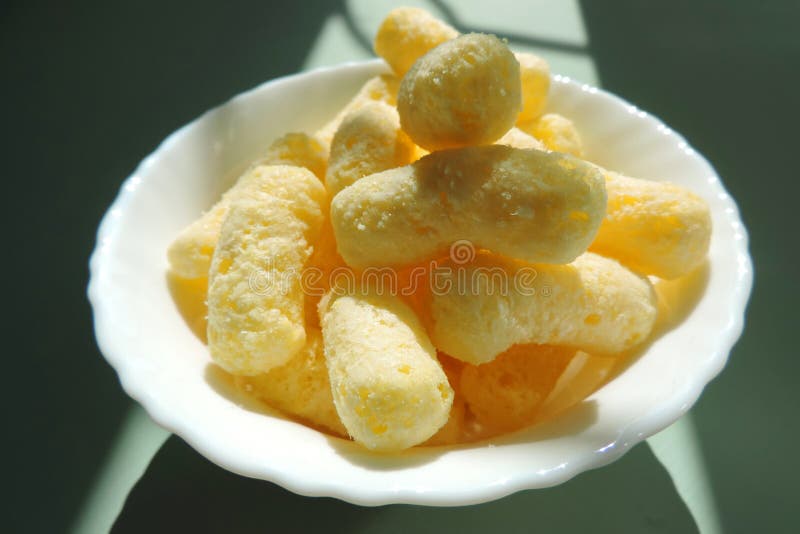 Crunchy Corn Snacks , Corn Sticks with Powdered Sugar, Contrast of ...