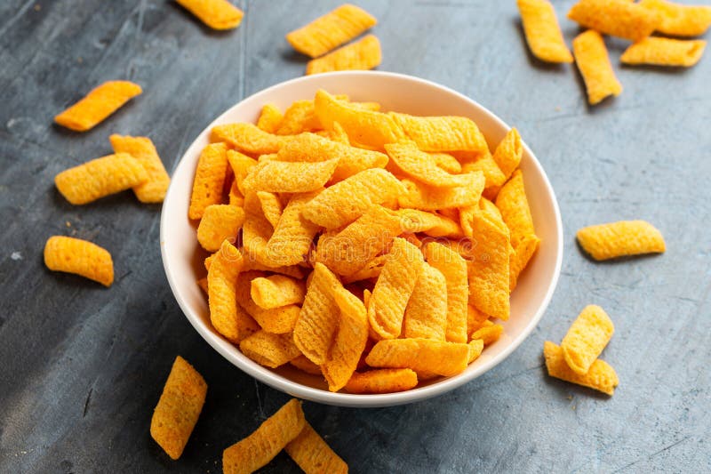 Crunchy Nacho Cheese Corn Snack in White Bowl Stock Photo - Image of ...