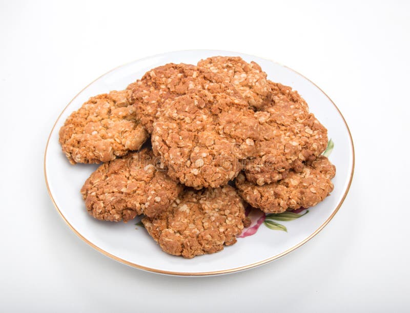 Crunchy Oat Biscuits/cookies on a White Plate with Gold Rim Stock Image ...