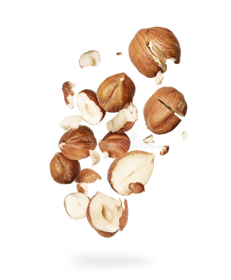 Crushed Hazelnuts in the Air Isolated on a White Background Stock Photo ...