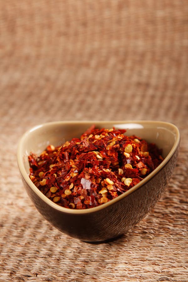 Crushed Red Hot Chilli Pepper in Bowl Stock Photo - Image of spices ...