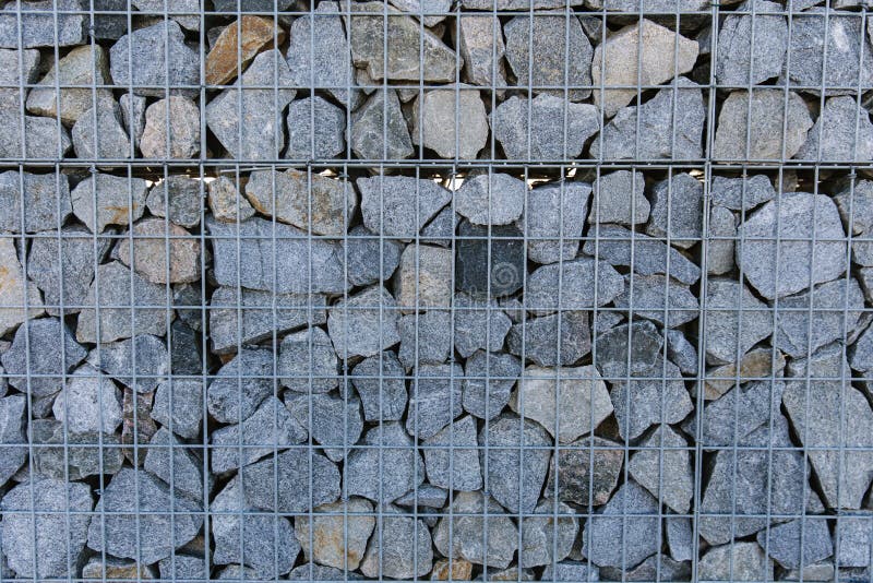 The Crushed Stone is Fixed in the Mesh. a Fence Made of Natural Stone ...
