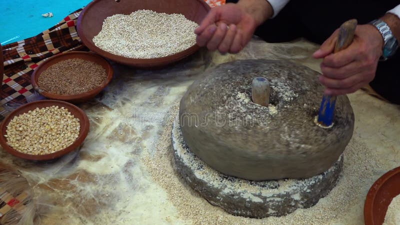 Crushing Wheat with Turning Stone To Make Flour Stock Footage - Video ...