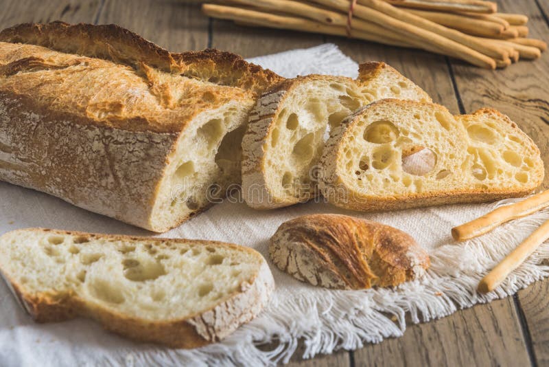 Crusty French White Bread on Rustic Wooden Table Stock Image - Image of ...