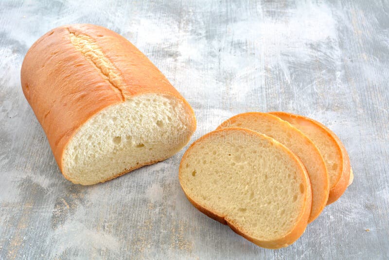 Crusty Italian loaf stock image. Image of slice, board - 231396177