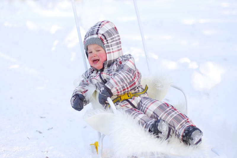 Crying Baby on Sledge in Winter Stock Photo - Image of childhood, tears ...