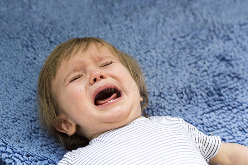 Crying Boy stock image. Image of infant, lying, face - 42640419