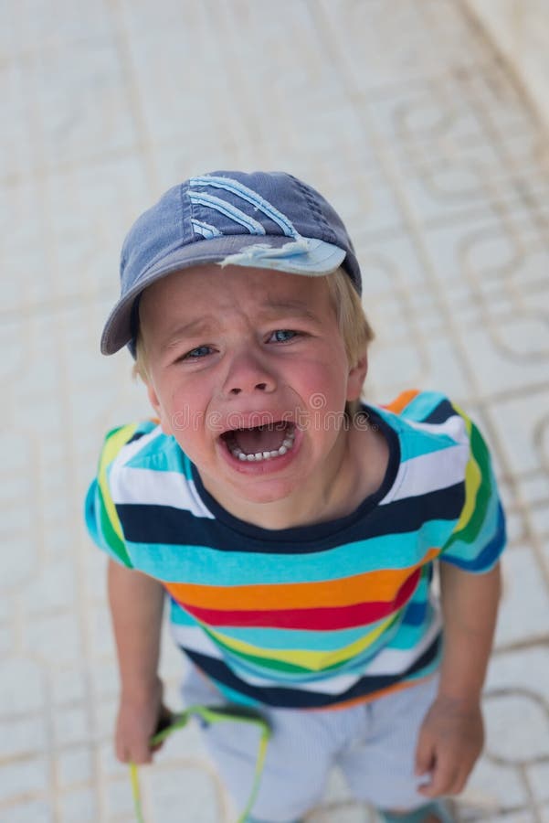 Crying Boy Standing on the Street Stock Photo - Image of crying, male ...
