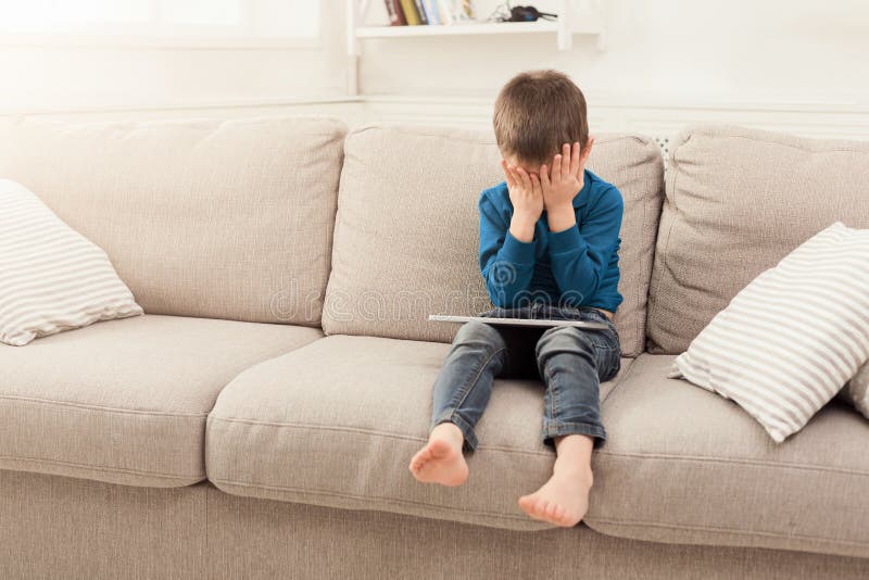 Crying Boy with Digital Tablet at Home Stock Photo - Image of leisure ...