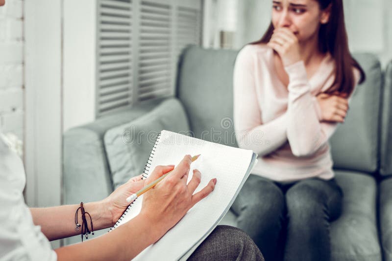 Therapist Making Notes while Listening To Crying Stressed Client Stock ...
