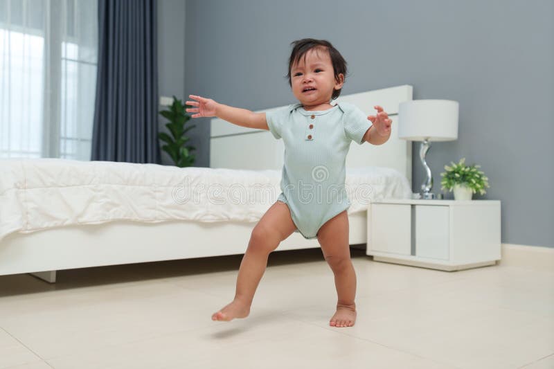 Crying Baby Carried by Mother Enjoying in Inflatable Pool Stock Photo ...