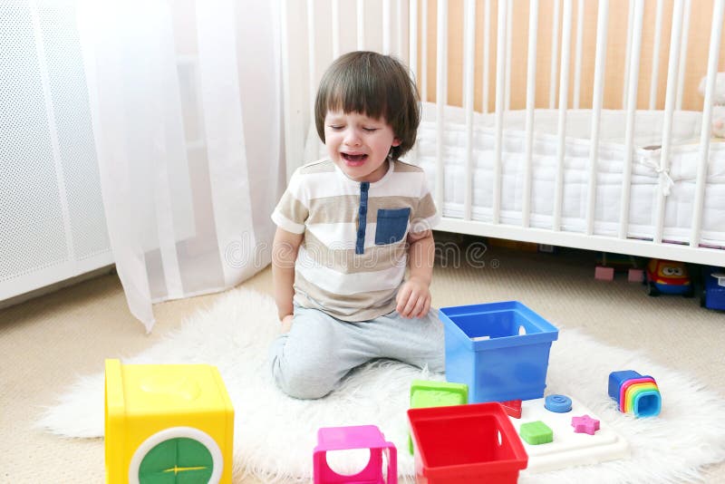 Crying Little Boy Scatters Toys Stock Image - Image of small ...