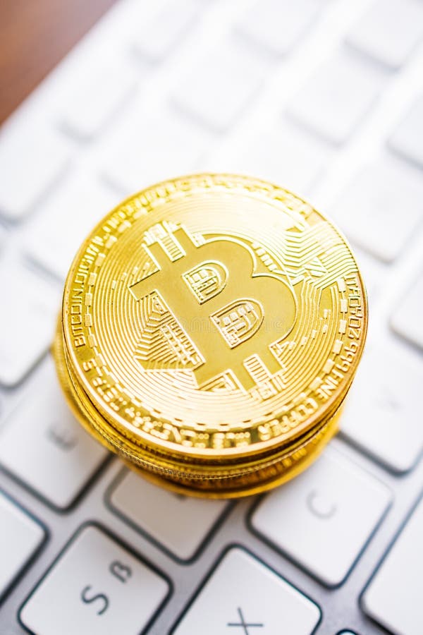 Cryptocurrency. Bitcoin Virtual Money. Gold Coins Laying on Computer ...