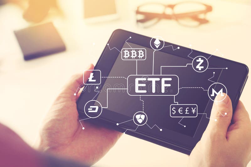 Cryptocurrency ETF Theme with Person Holding Tablet Computer Stock ...