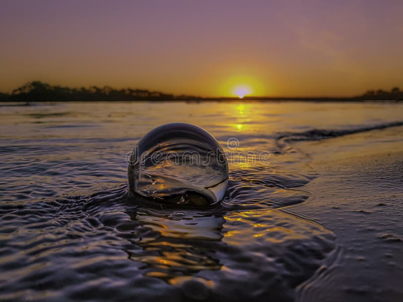 Crystal Ball Beach Sunset stock photo. Image of refraction - 243022874