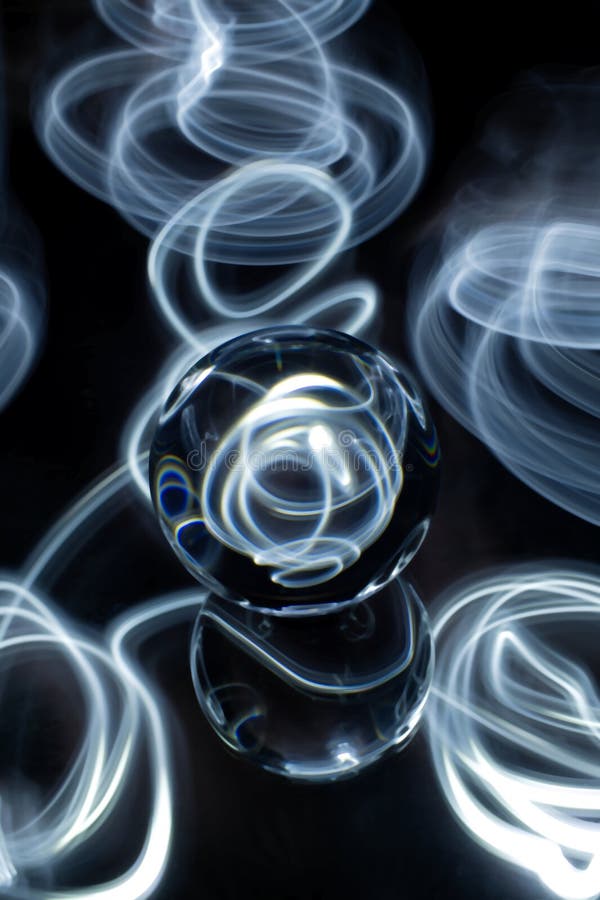 Light Painting on Crystal Ball, Reflected in Mirror. Abstract ...