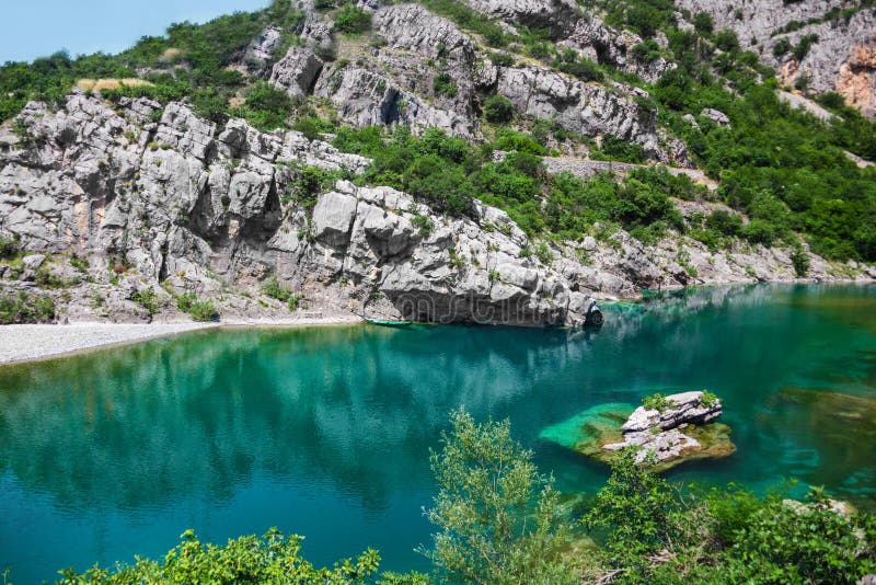 Crystal Blue Mountain Lake with Rocks Stock Image - Image of outdoor ...