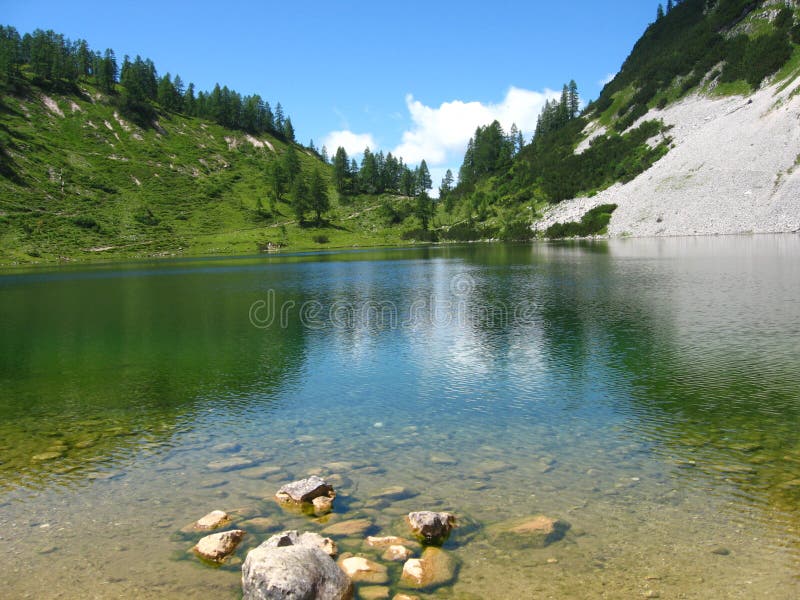 Crystal-clear alpine lake stock image. Image of crystal - 21331485