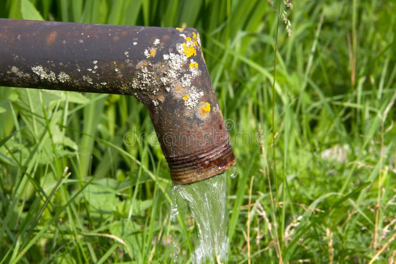 Crystal Clear Water Flows from a Rusty Pipe Stock Photo - Image of ...