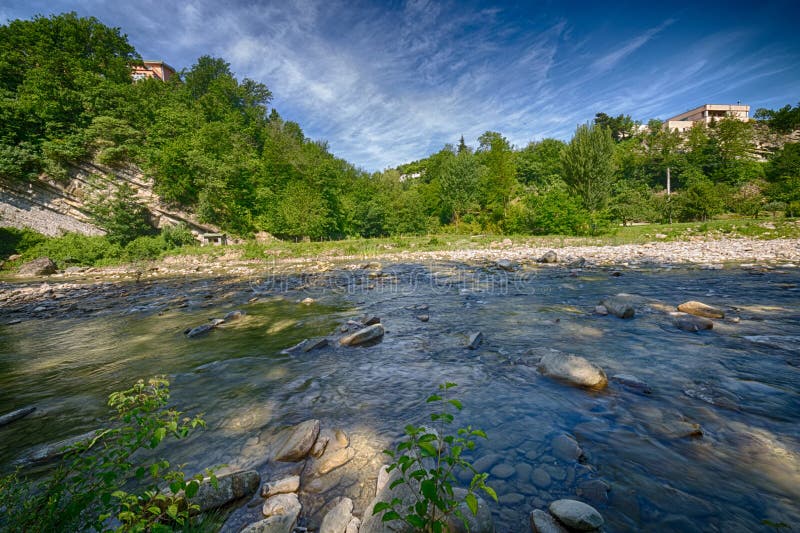 Water on river stones stock photo. Image of bologna, stones - 98135044